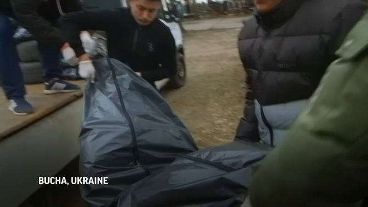 National Post | Police Officers Inspect Remains Of Bucha Victims