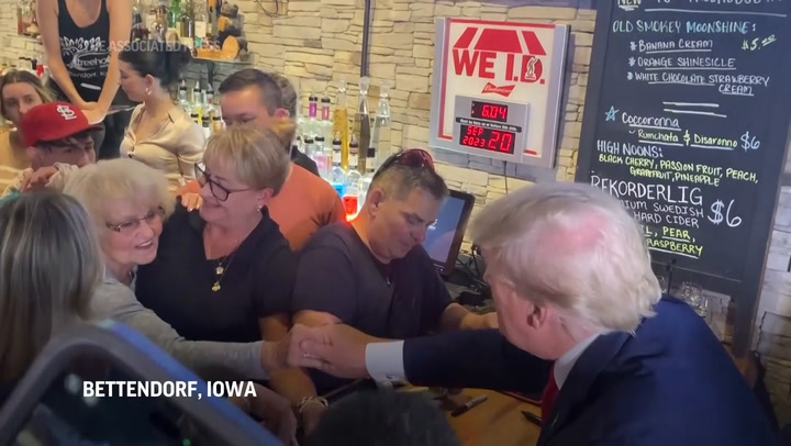 National Post | Trump Autographs Woman'S Tank Top Shirt At Iowa ...